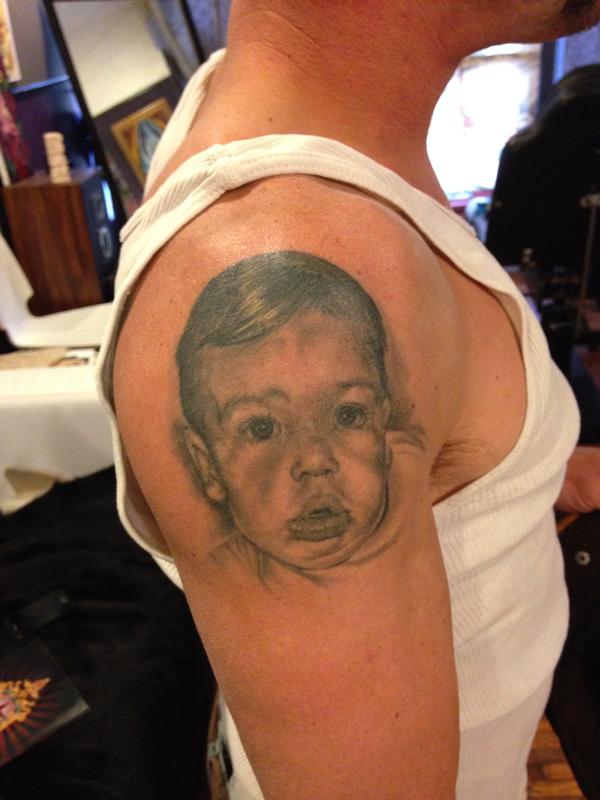 healed baby portrait in black and grey by Frank Mcmanus: TattooNOW