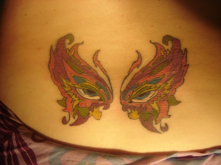 Lower back tattoo by Clare Miles: TattooNOW