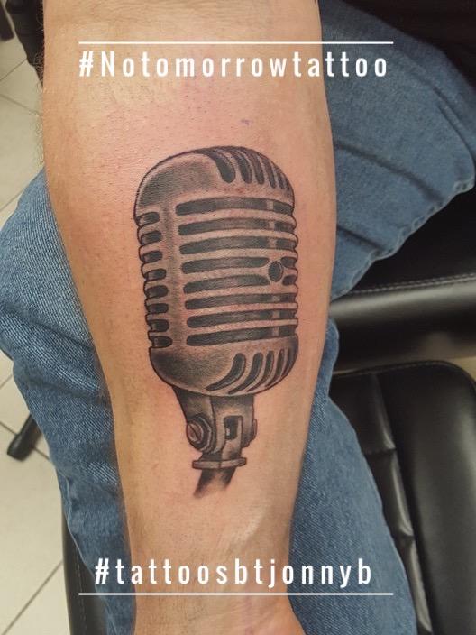 Mic Tattoo On Lower Arm