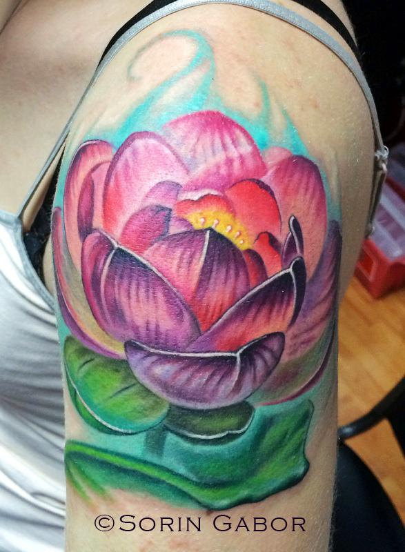 realistic color lotus tattoo on shoulder by Sorin Gabor: TattooNOW