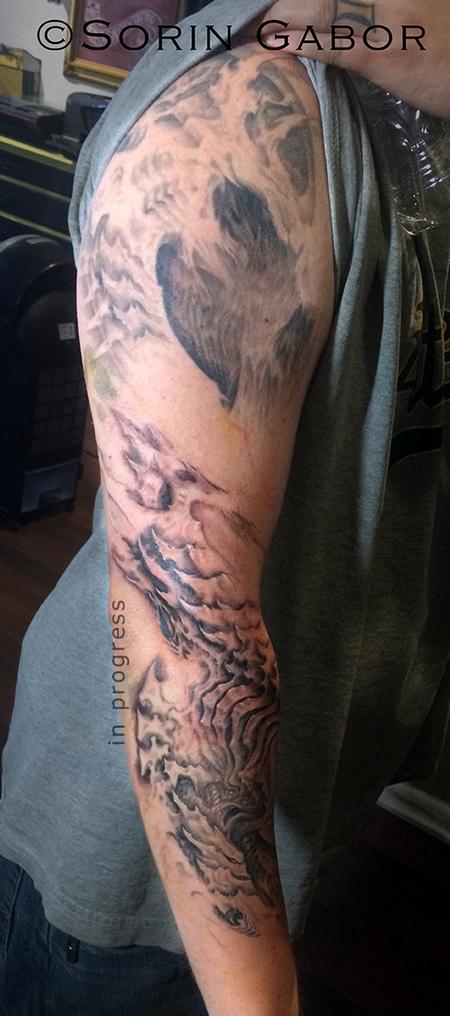realistic and graphic black and gray sleeve tattoo in progress by Sorin ...